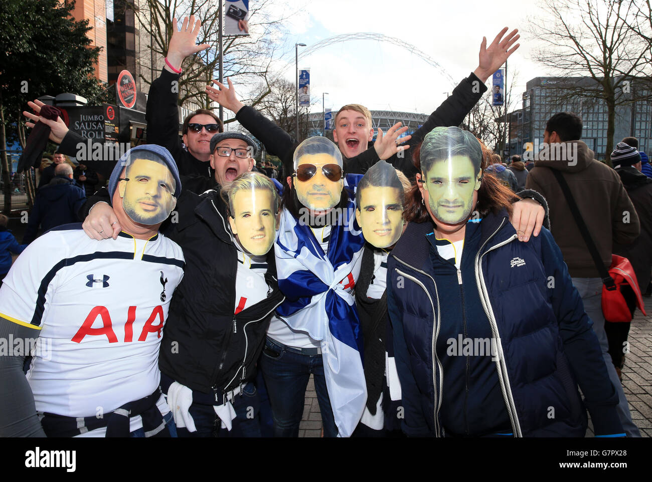 Tottenham Hotspur fans pose for a photograph as they make their way ...