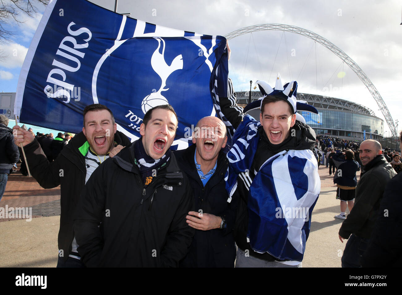 Tottenham Hotspur fans pose for a photograph as they make their way ...