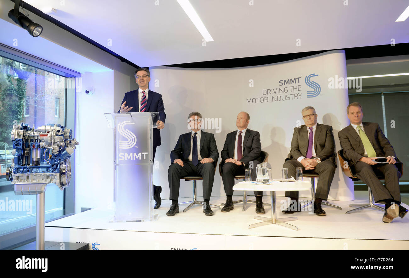 EDITORIAL USE ONLY Mike Hawes, Chief Executive, SMMT, speaks as (left ...