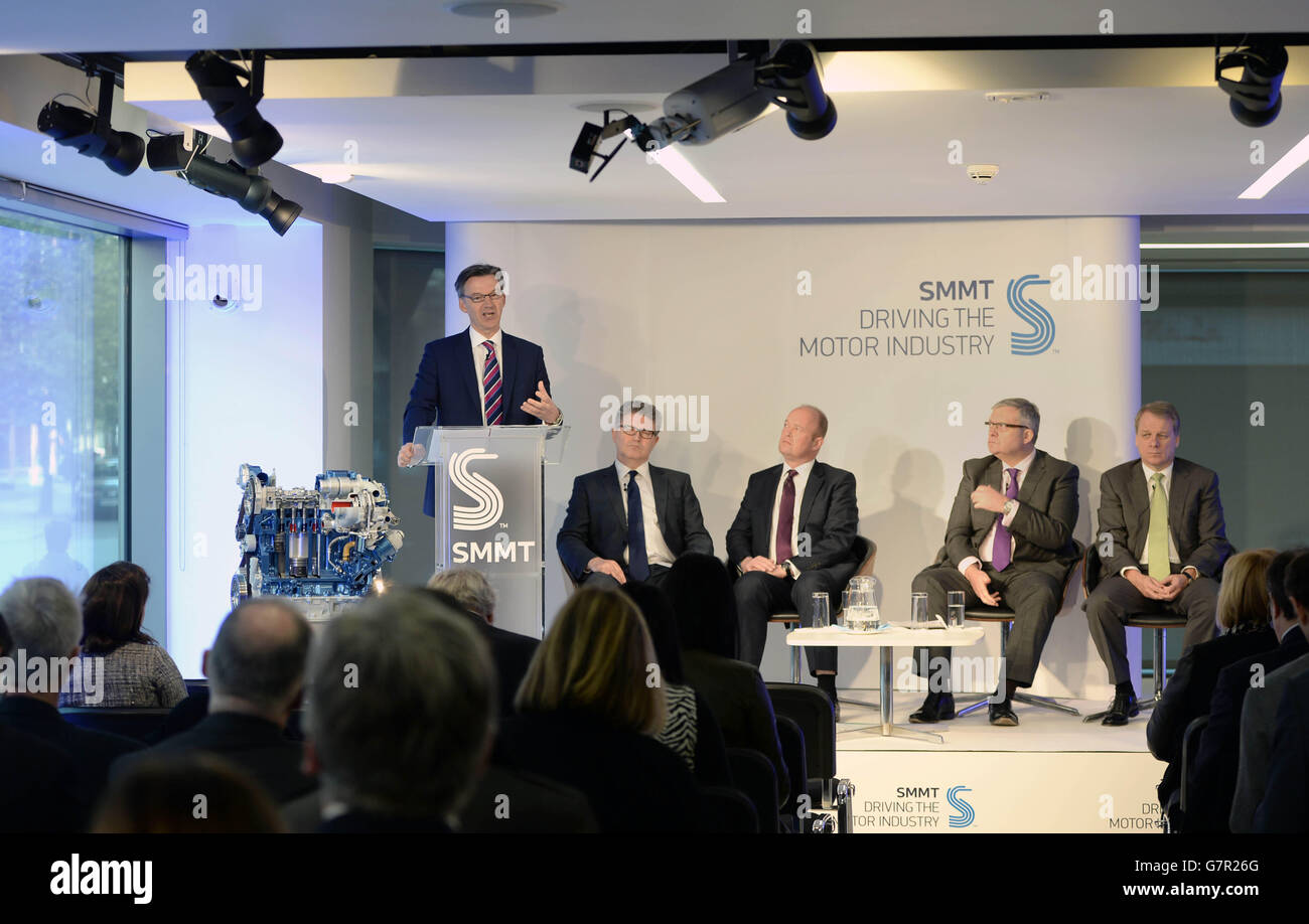 EDITORIAL USE ONLY Mike Hawes, Chief Executive, SMMT, speaks as (left ...
