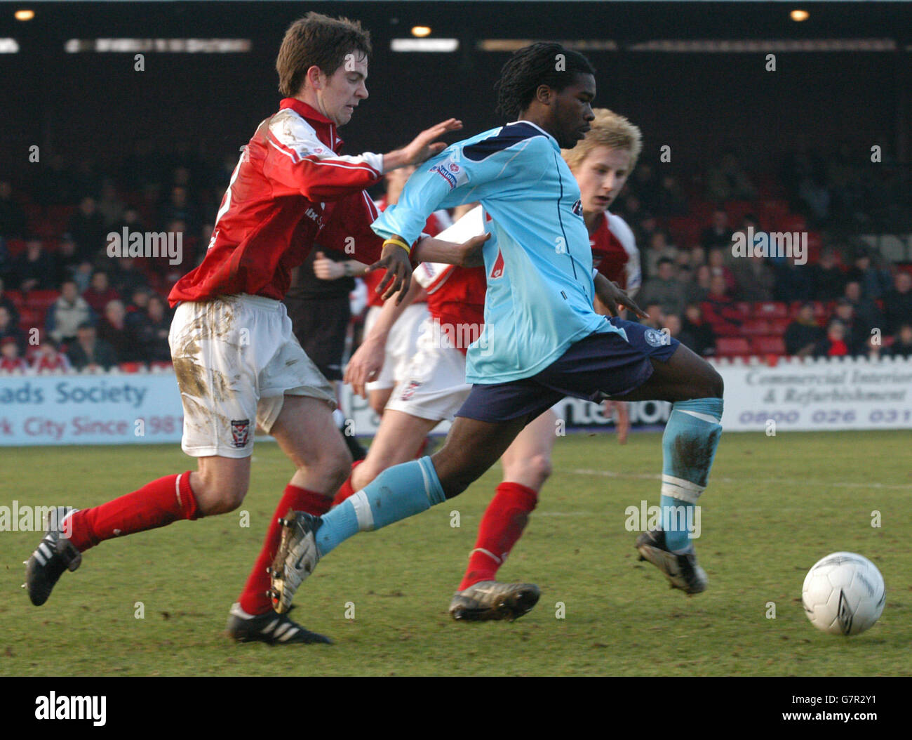 Aldershot striker Aaron McLean (right) shields the ball from York's ...