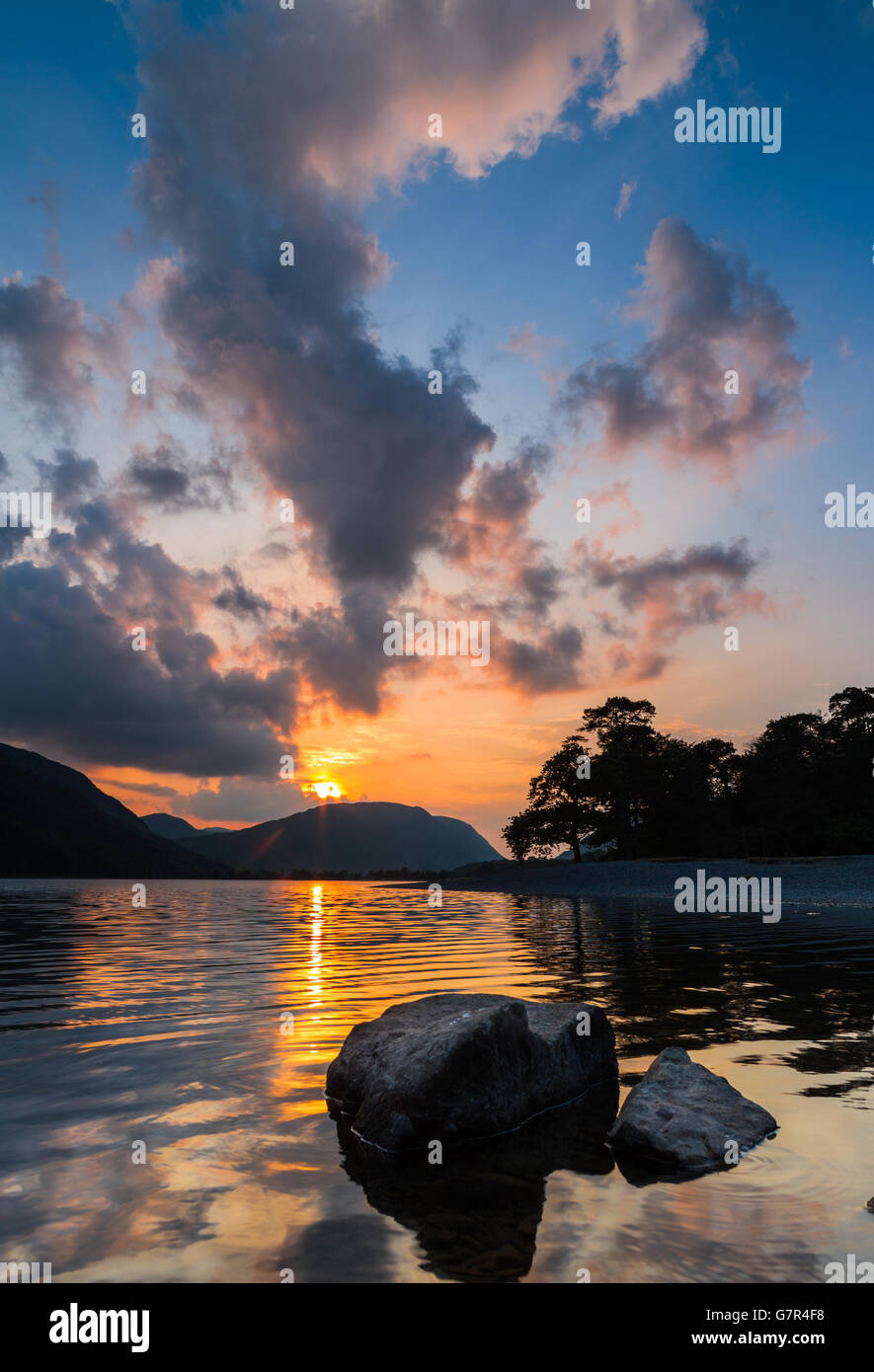 Warm Sunset Sky Reflected on Calm Lake Surface Stock Photo - Alamy