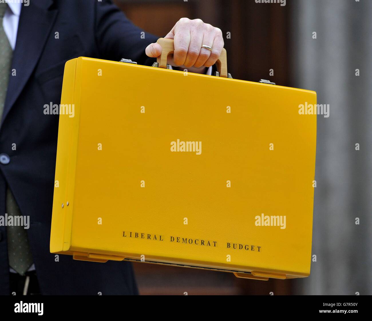 Chief Secretary to the Treasury Danny Alexander holds his yellow budget ...