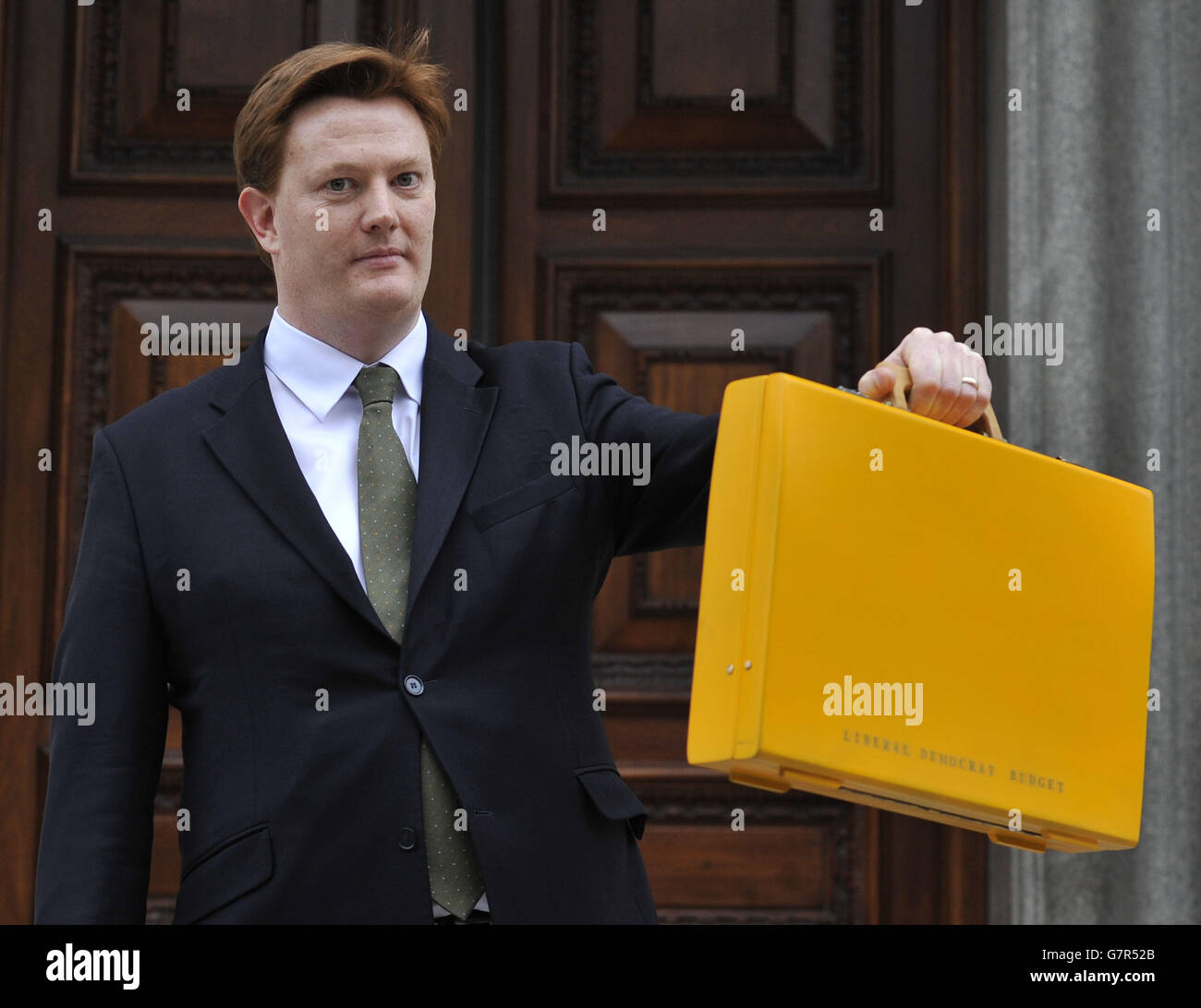 Chief Secretary to the Treasury Danny Alexander holds his yellow budget ...