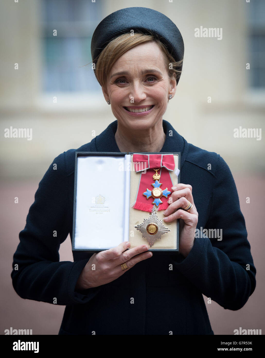 Dame Kristin Scott Thomas holding her Dame Commander of the British ...