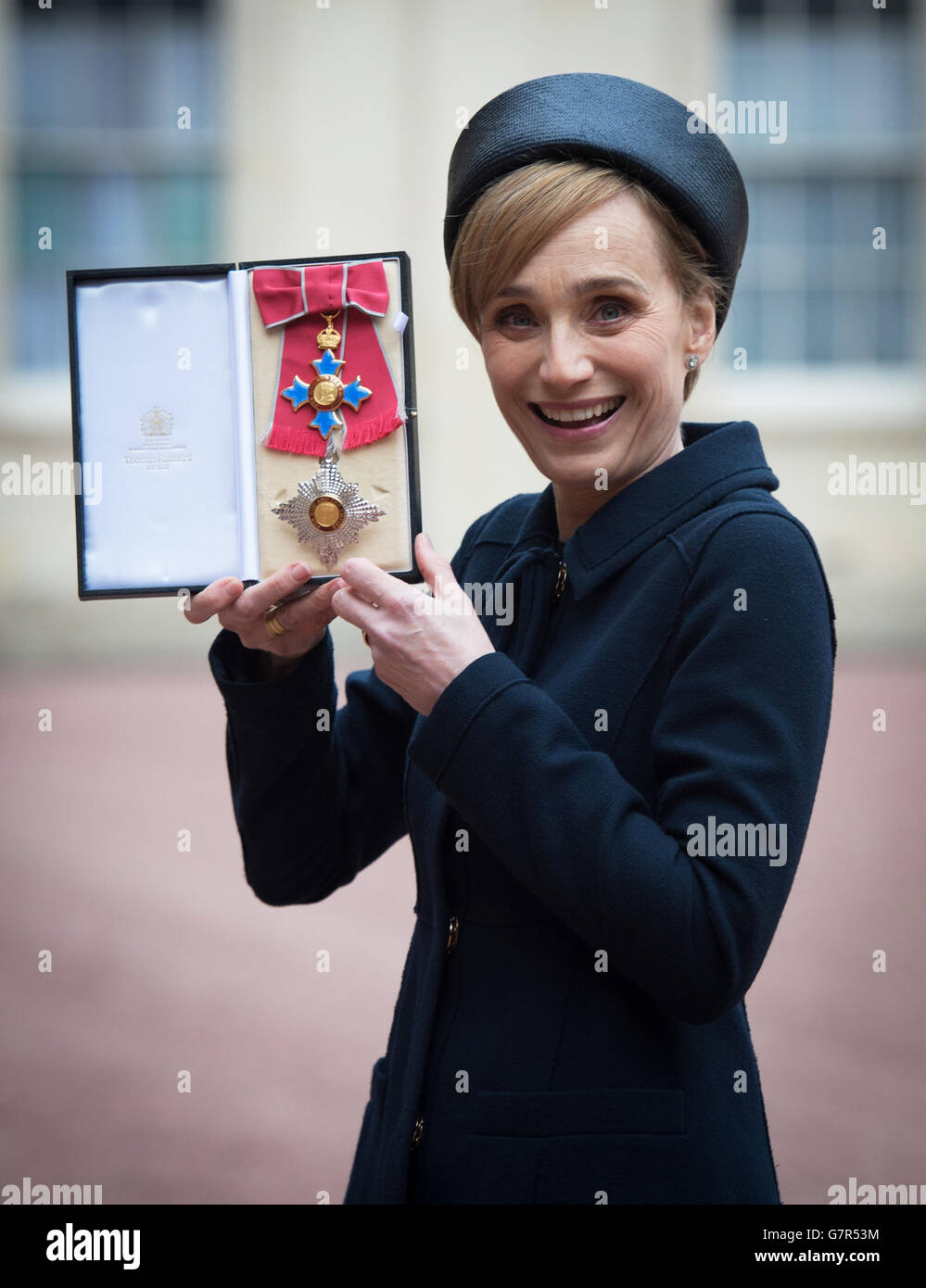 Dame Kristin Scott Thomas holding her Dame Commander of the British ...