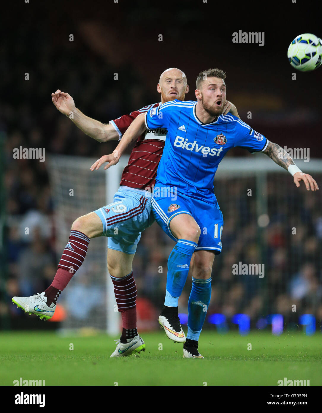 West Ham United's James Collins (back) and Sunderland's Connor Wickham ...