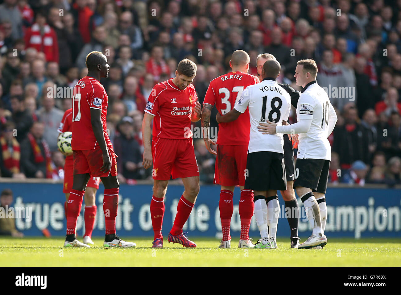 Liverpool's Steven Gerrard (centre) is shown the red card by referee ...