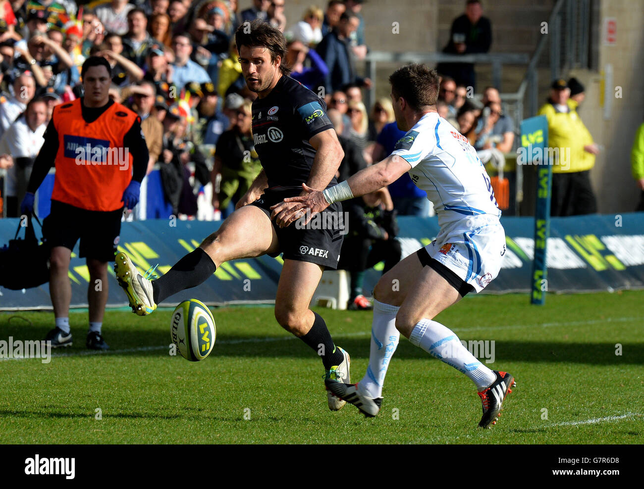 Saracens Marcelo Bosch kicks the ball forward past Exeter's Ceri ...