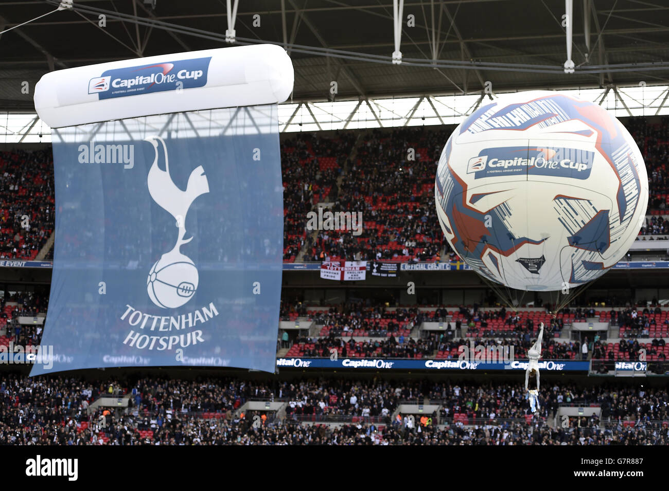A high wire trapeze artist delivers the Capital One Cup before kick off ...