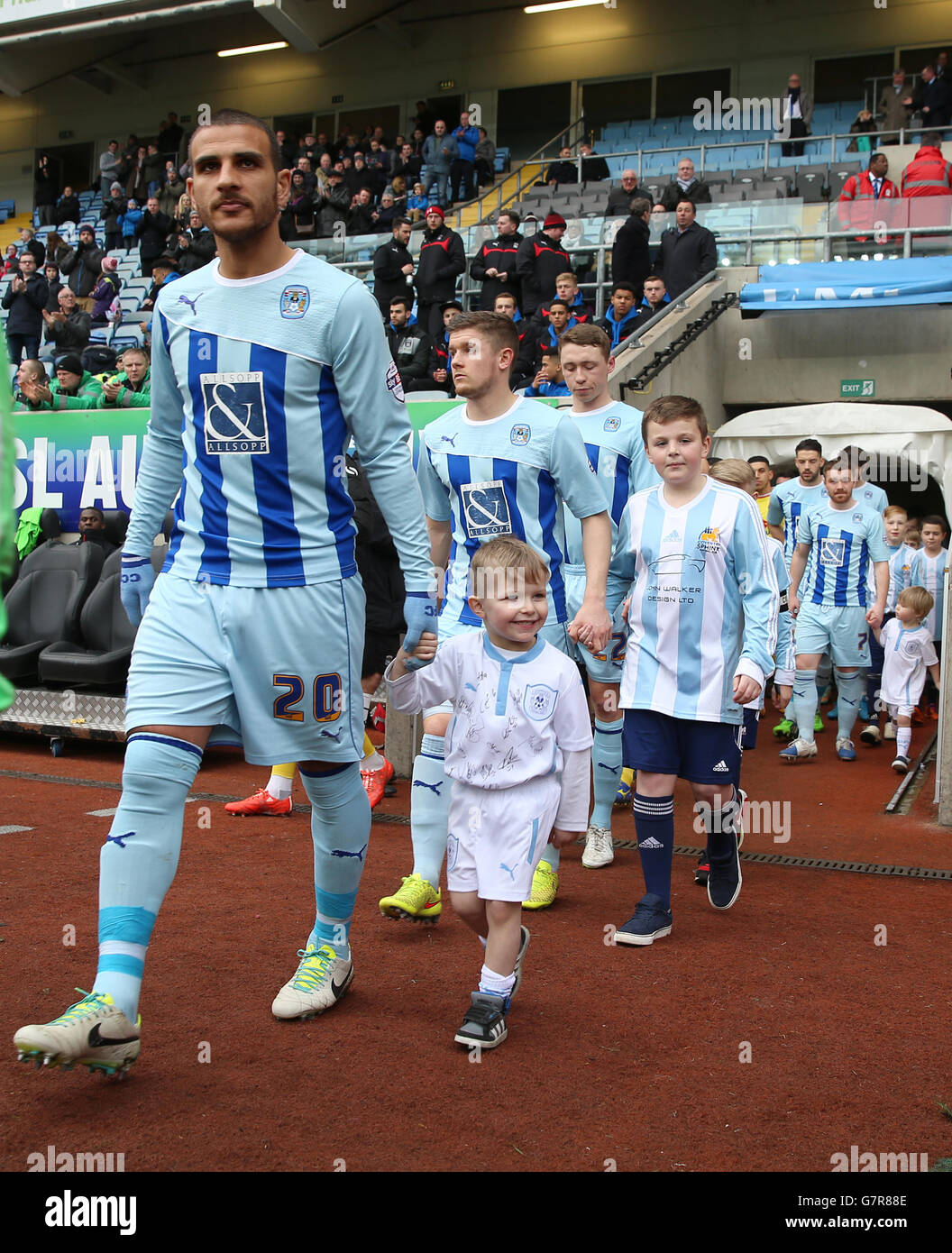 Coventry City's Marcus Tudgay with a matchday mascot as they make their ...