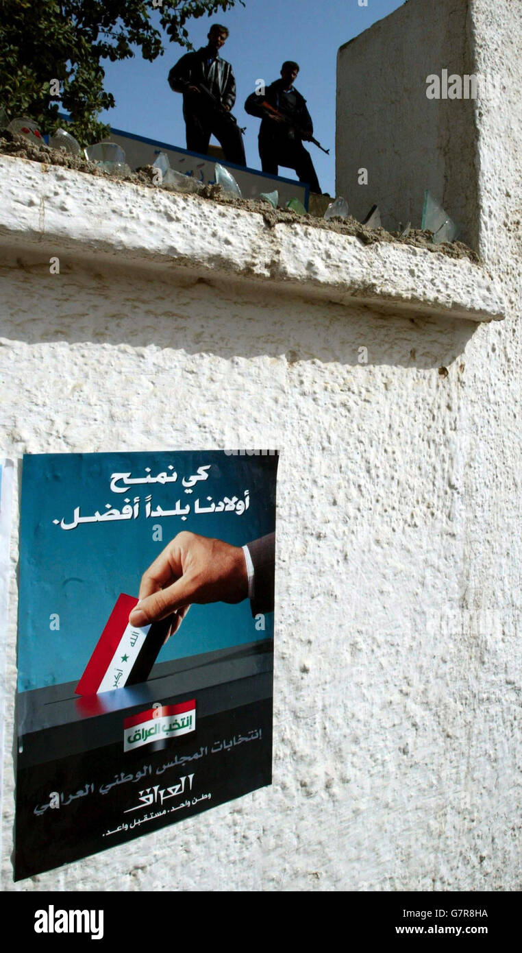 Poster encouraging iraqis to vote placed on wall polling station hi-res ...