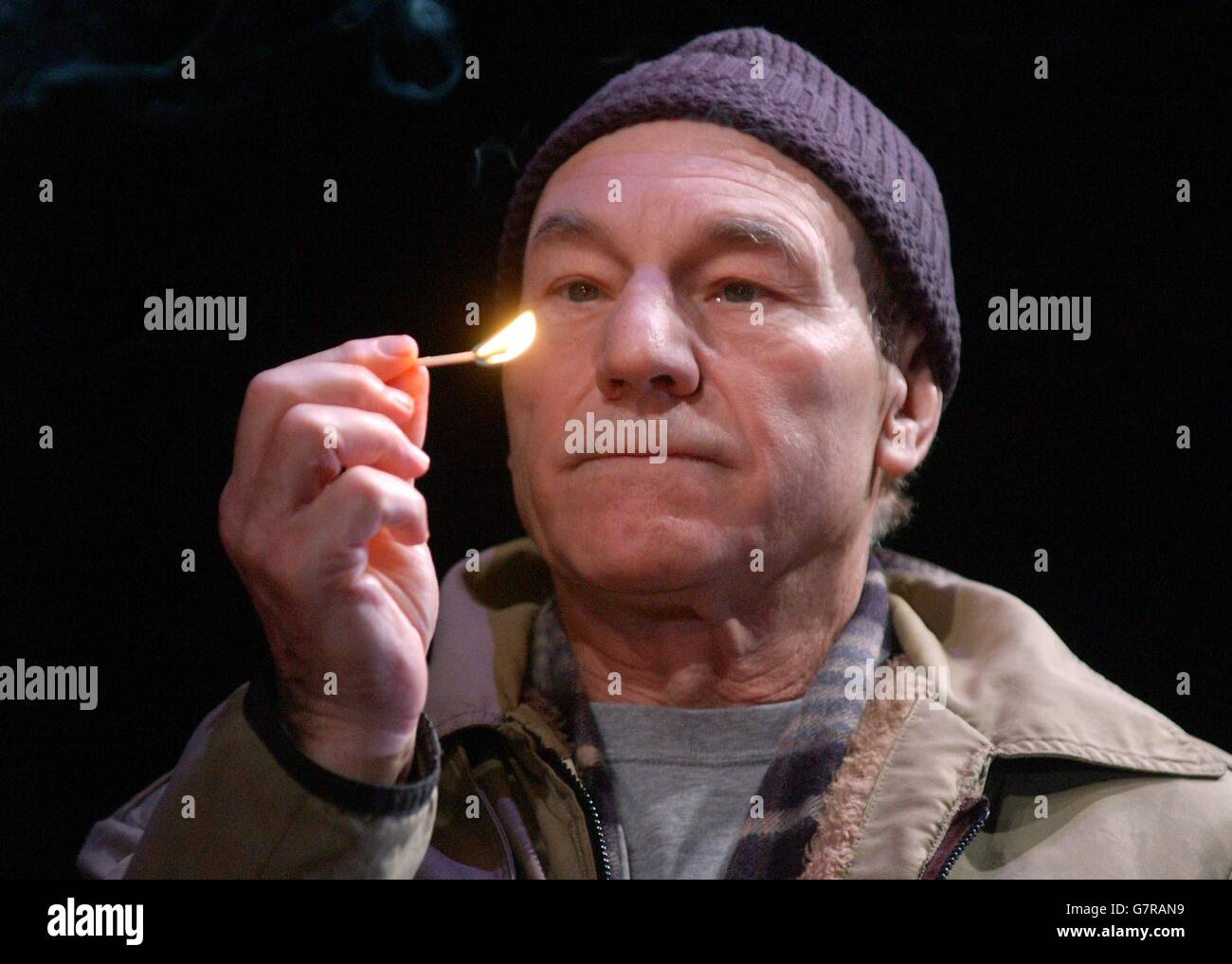 Showbiz theatre celebrity performing on stage costume wooly hat match ...