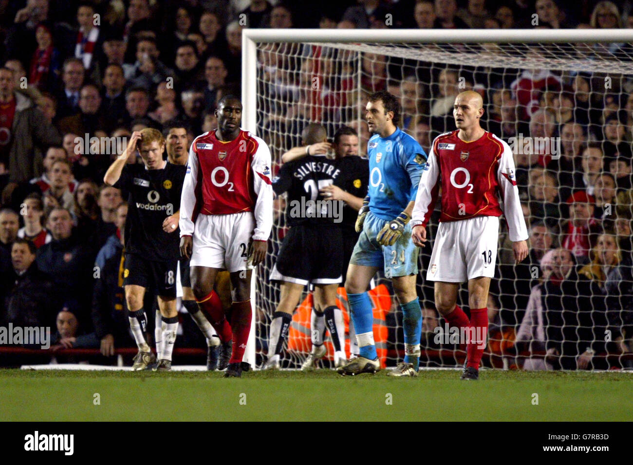 Arsenal's Sol Campbell, Manuel Almunia and Pascal Cygan stand dejected ...
