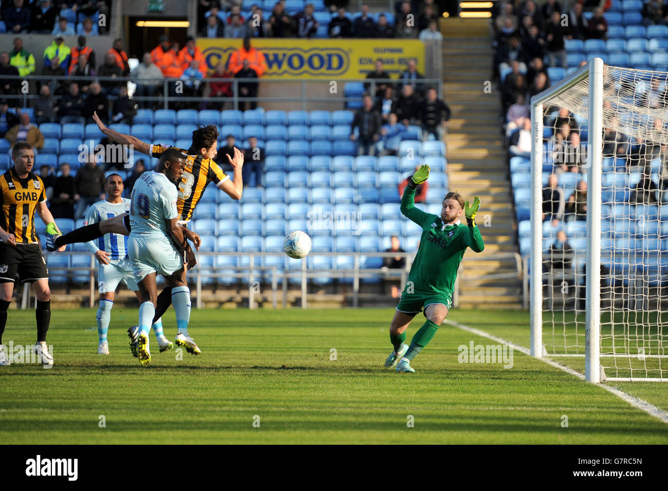 Coventry City's Frank Nouble (third left) with a headed effort on goal ...