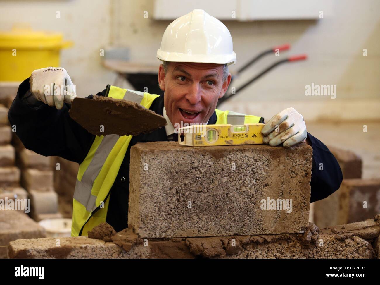 Scottish Labour leader Jim Murphy tries his hand at brick laying as he ...