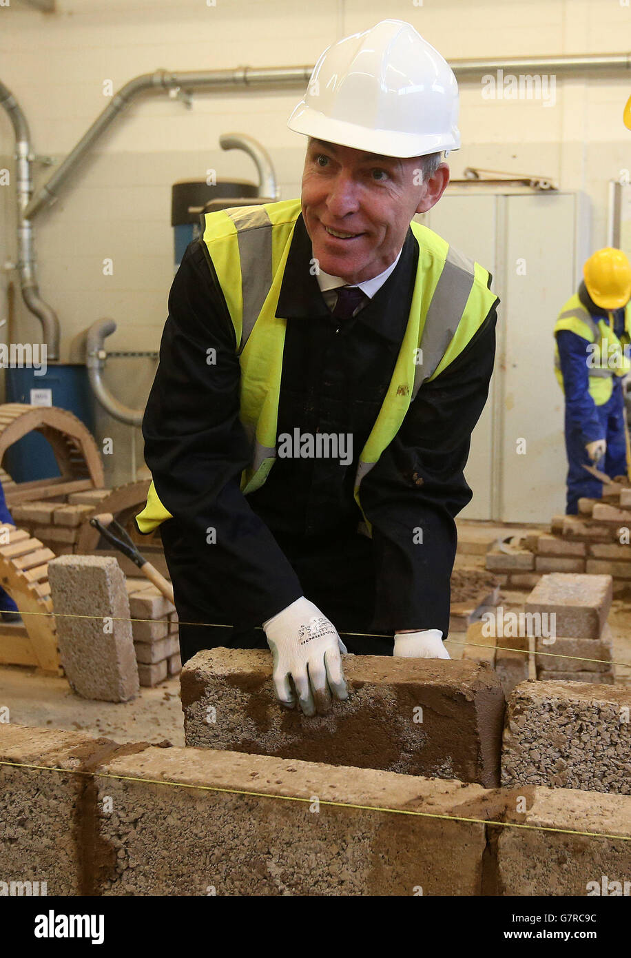 Scottish Labour leader Jim Murphy tries his hand at brick laying as he ...