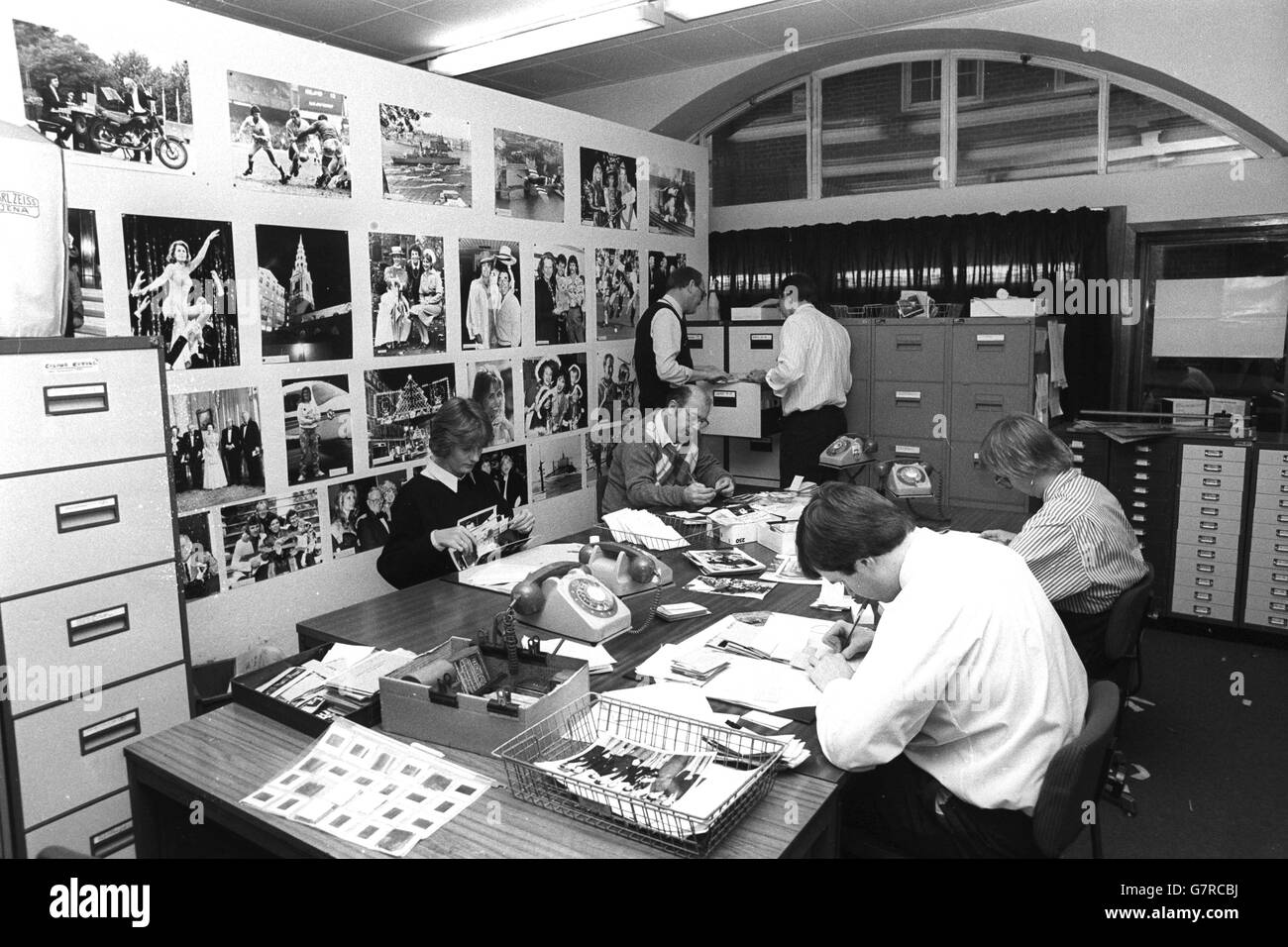 Interior view of the Press Association Photo Library, with staff at ...
