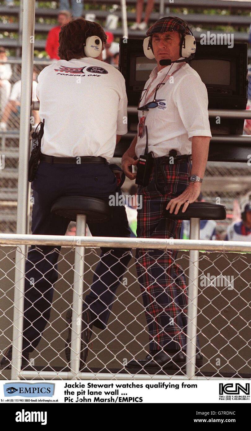 Jackie stewart watches qualifying from the pit lane wall hi-res stock ...