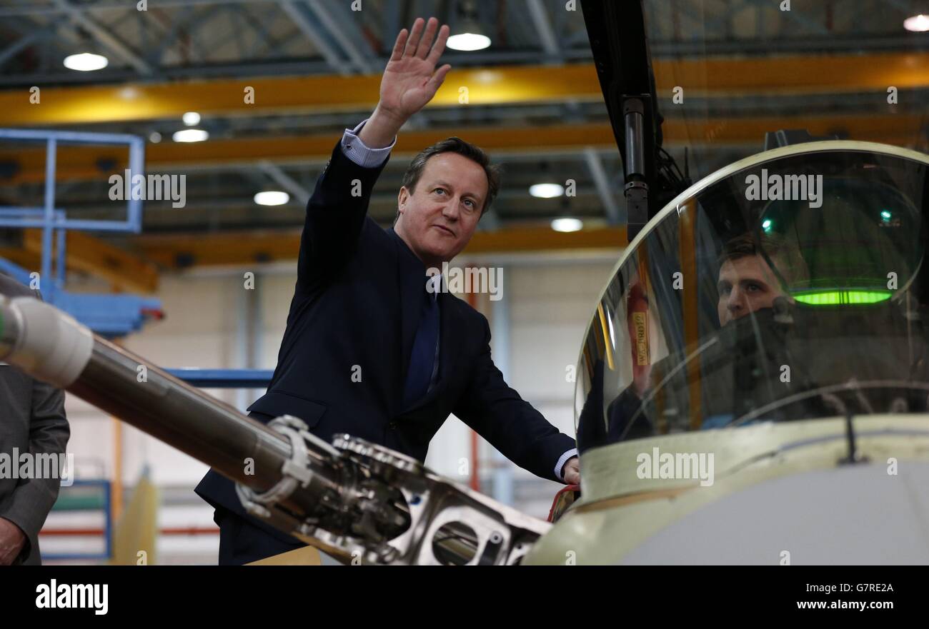 Prime Minister David Cameron talks to Sam Barrett in the cockpit of a ...