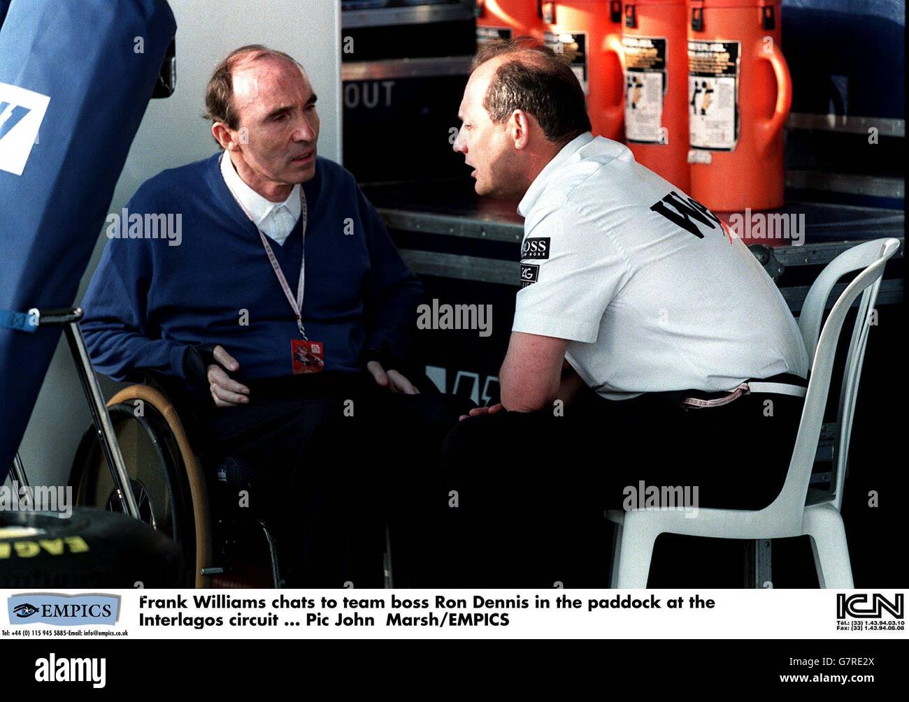 Frank Williams chats to team boss Ron Dennis in the paddock at the ...
