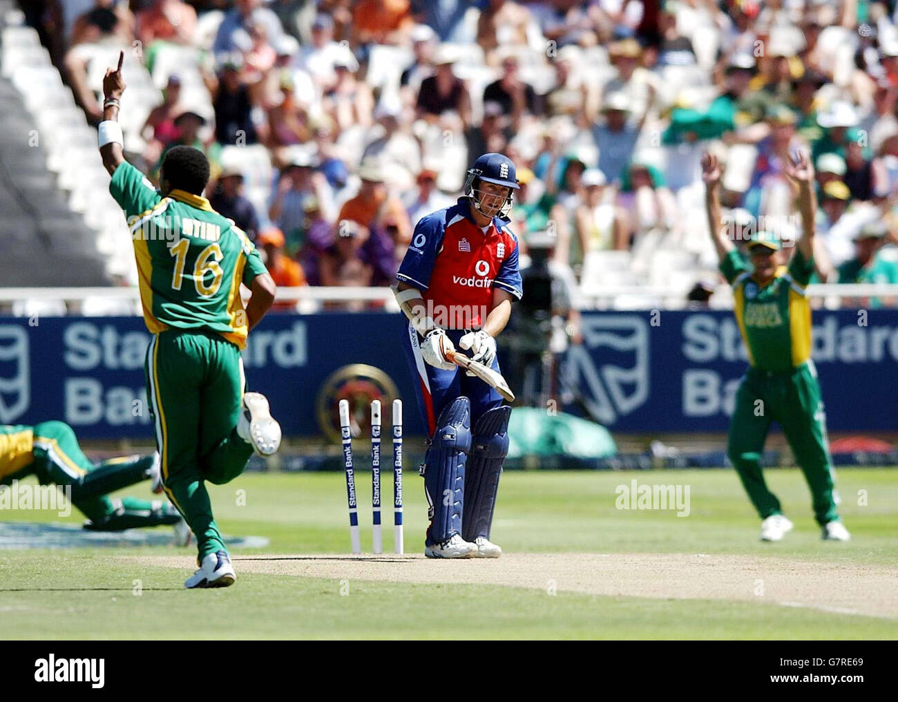 South Africa's Makhaya Ntini (left) celebrates after bowling England's ...