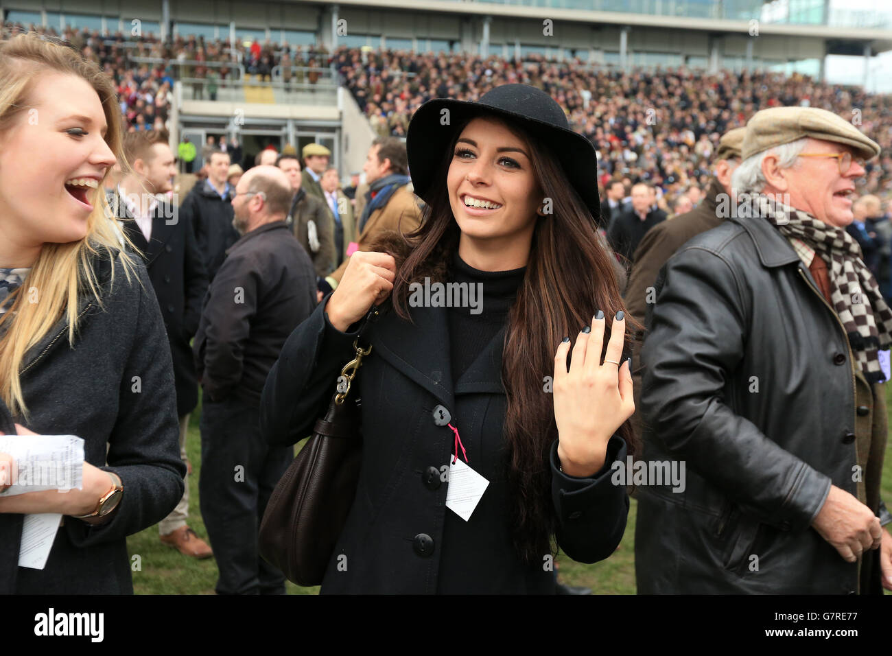 Racegoers cheer on their horse in The RSA Steeple Chase Stock Photo - Alamy