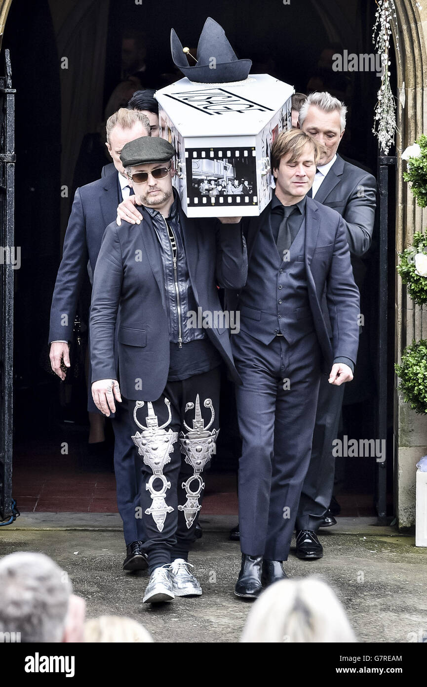 The Visage decorated and hat topped coffin of Steve Strange is brought ...