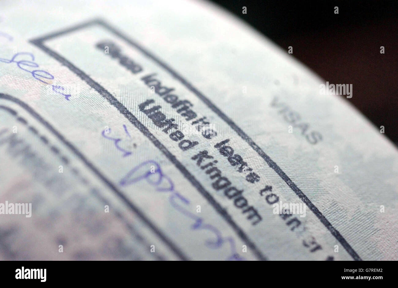 An immigration stamp for the United Kingdom in a passport after it was ...