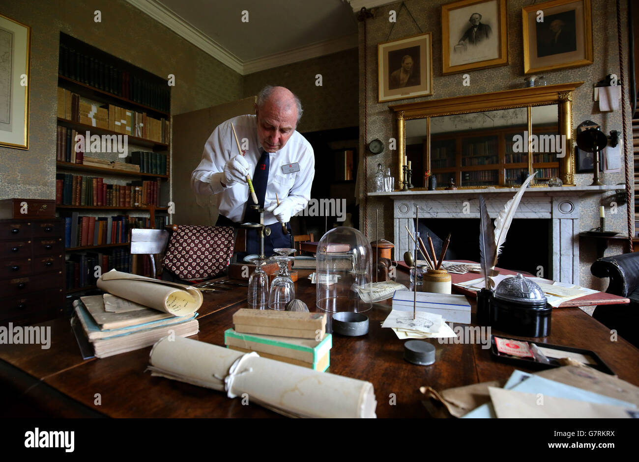 Phil Cole of English Heritage delicately cleans the objects and ...