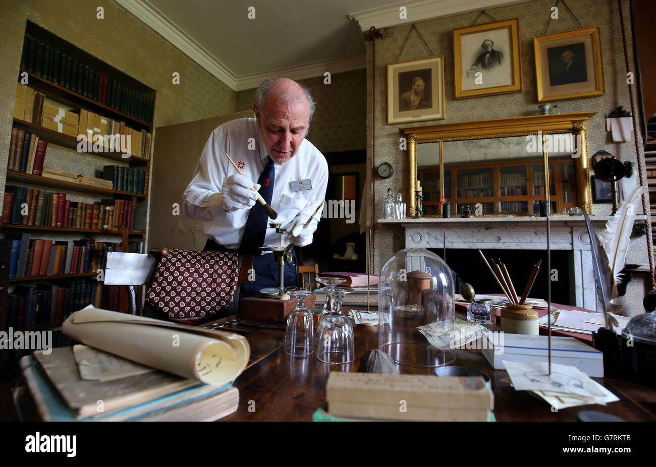 Phil Cole of English Heritage delicately cleans the objects and ...
