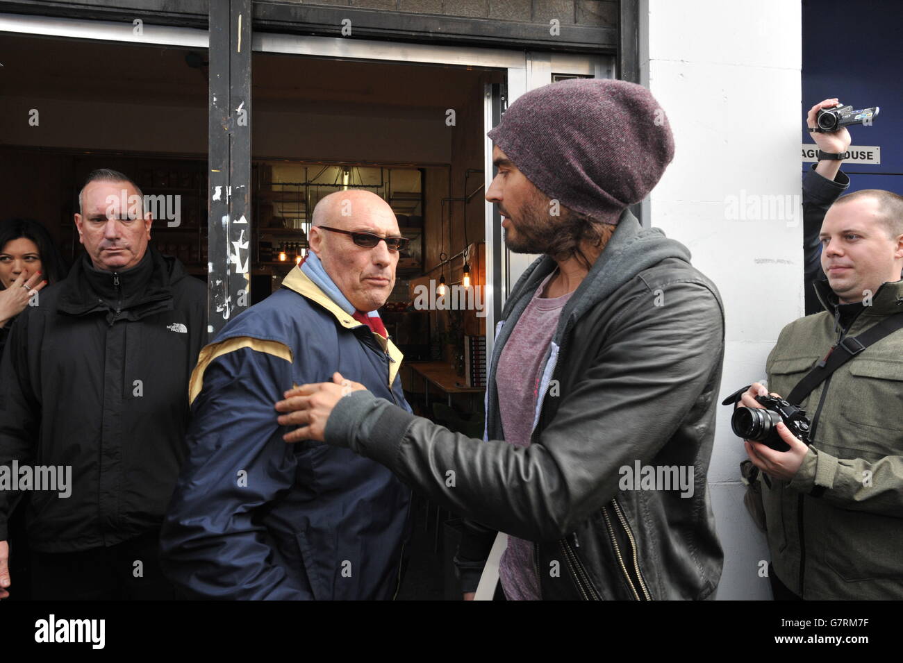 Russell Brand with his father Ron Brand as he arrives to open the Trew ...