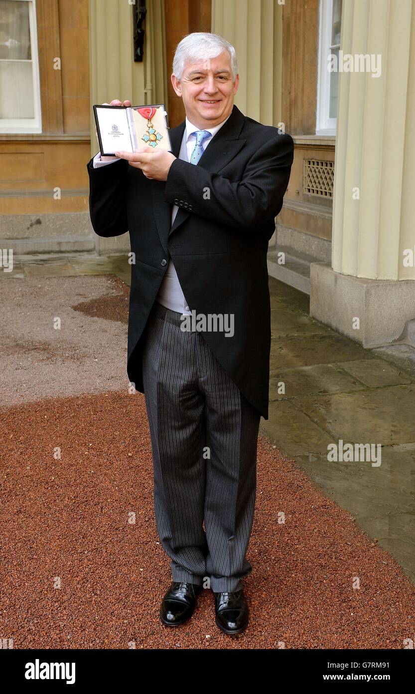 Roger Wright holds his Commander of the British Empire (CBE), after it ...