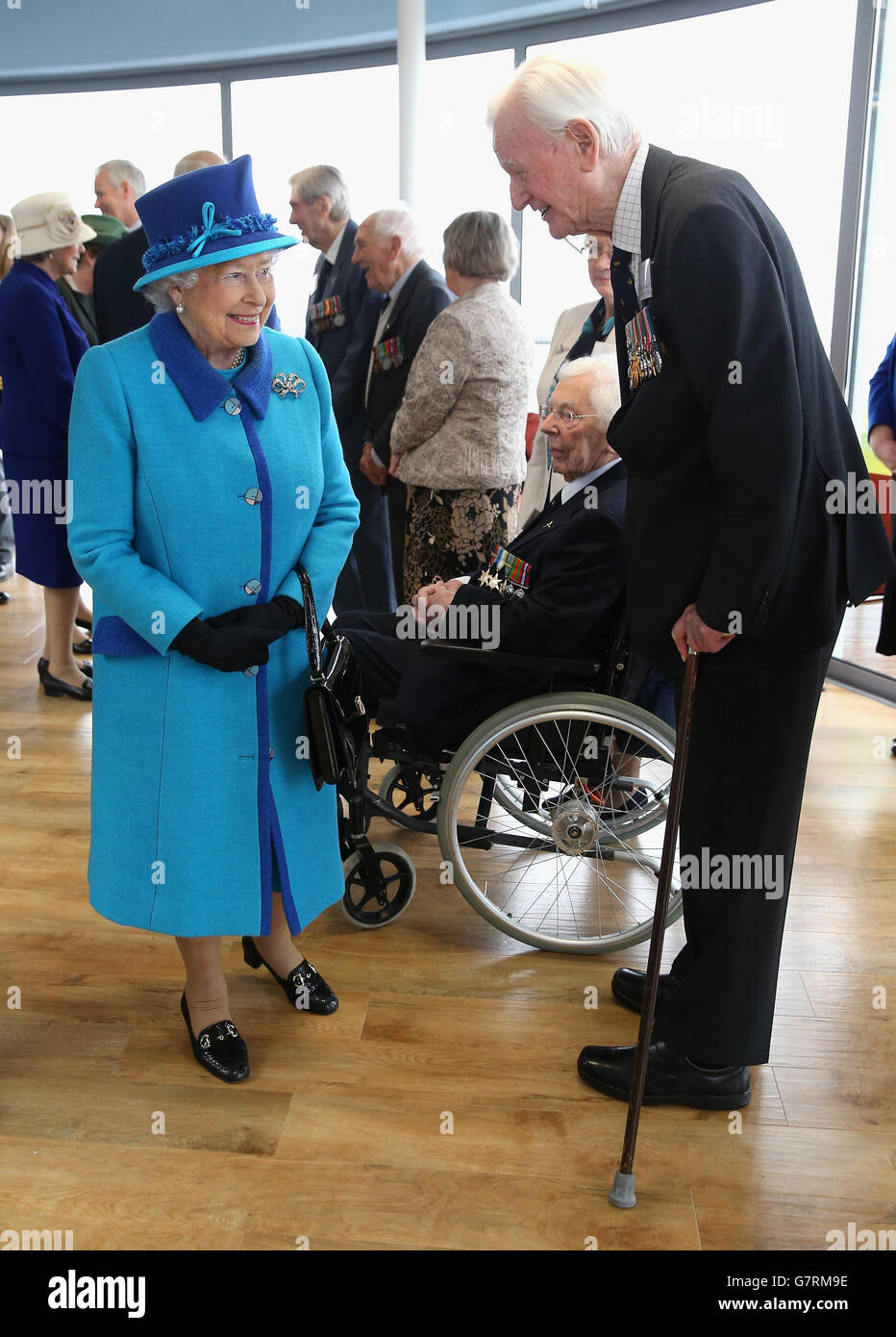 Queen Elizabeth II meets Wing Commander Tom Neil as she visits the ...