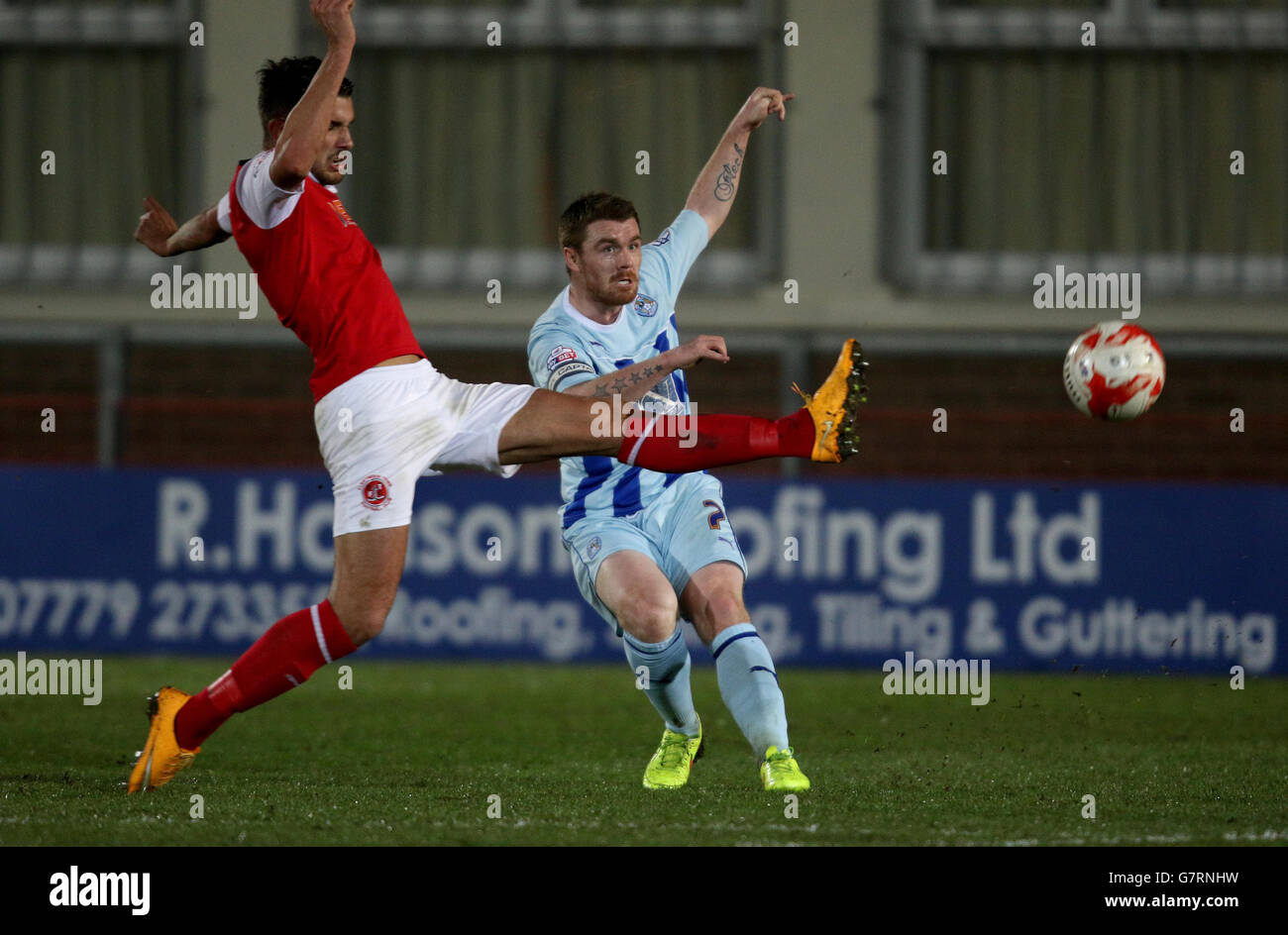 Coventry City's John Fleck (right) manages to get the ball past ...