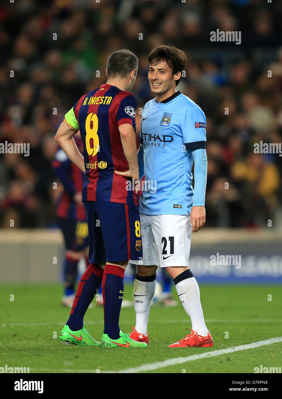 Barcelona's Andres Iniesta (left) with Manchester City's David Silva ...