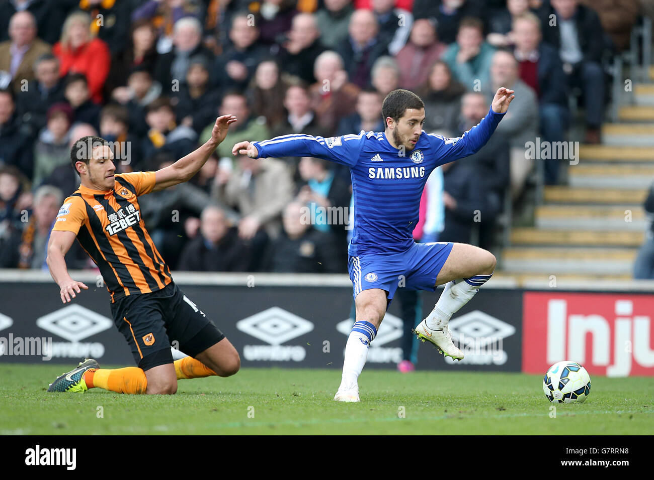 Hull City's Jake Livermore and Chelsea's Eden Hazard (right) battle for ...