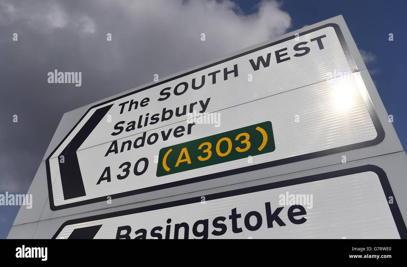 General view of a signpost for the A303 A-road and Thhe South West ...