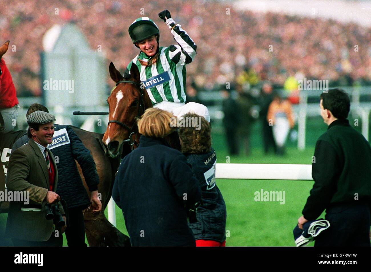 Jockey Tony Dobbin celebrates after winning the Grand National on Lord ...