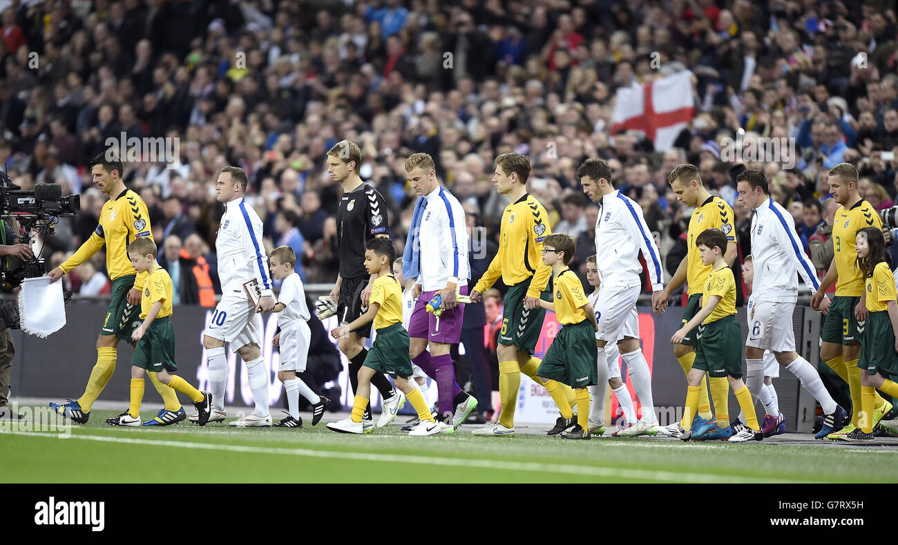 England Players and Lithuania players walk out onto the Wembley pitch ...
