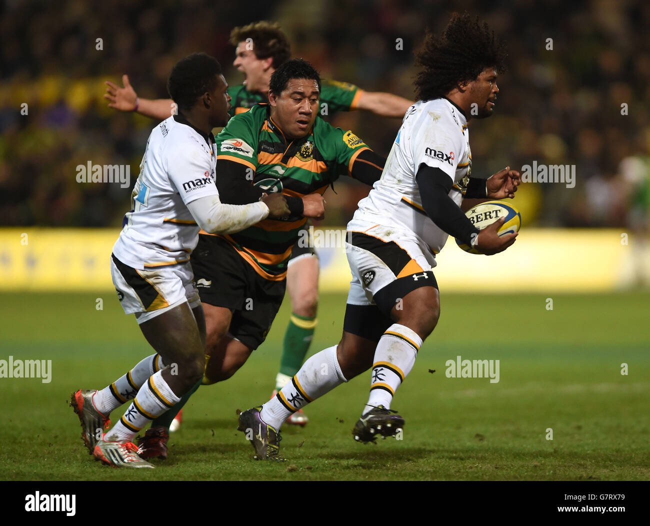 Northampton Saints' Salesi Ma'afu tackles Wasps' Ashley Johnson (right ...