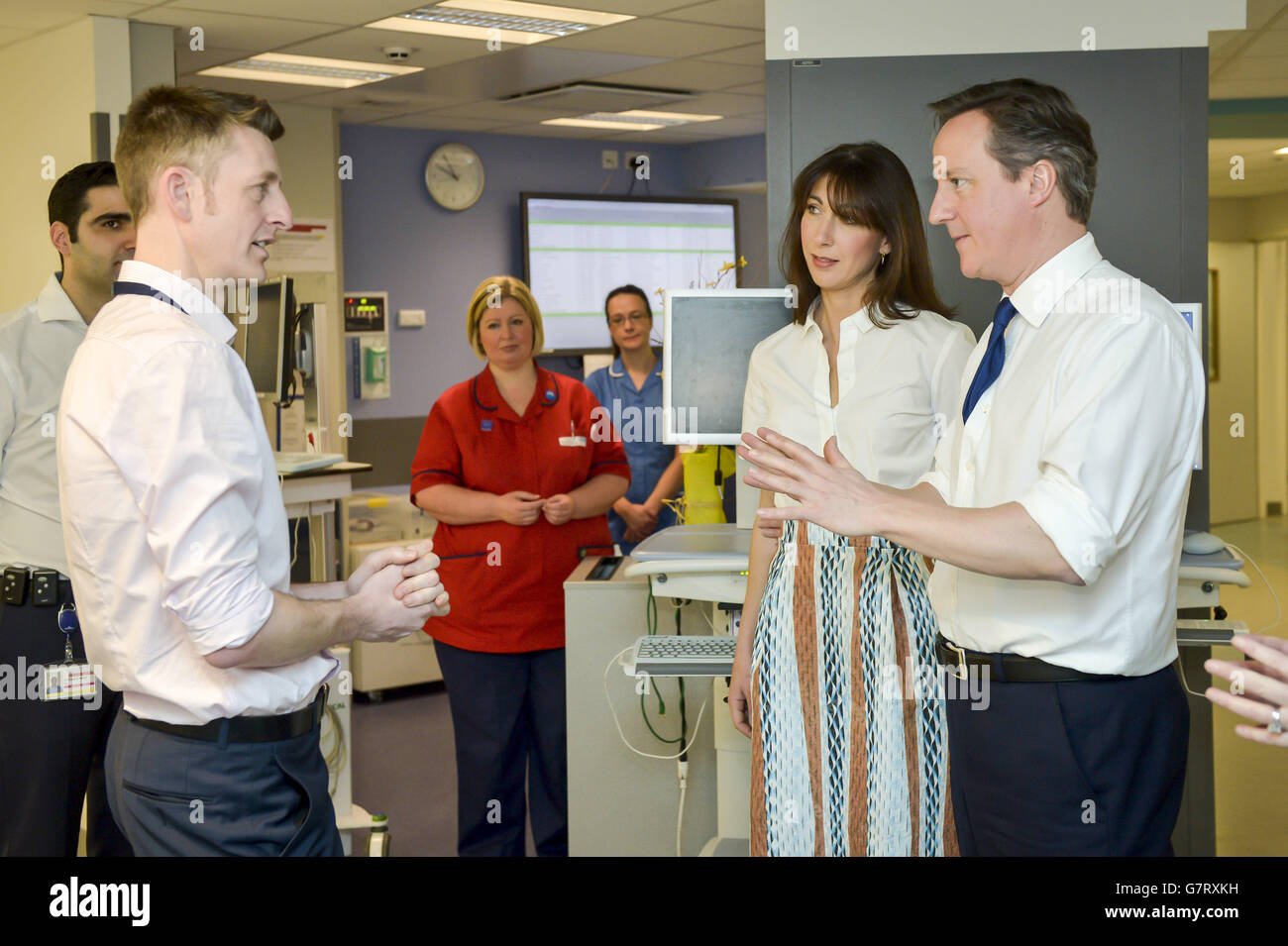 Prime Minister David Cameron and his wife Samantha Cameron talk to ...