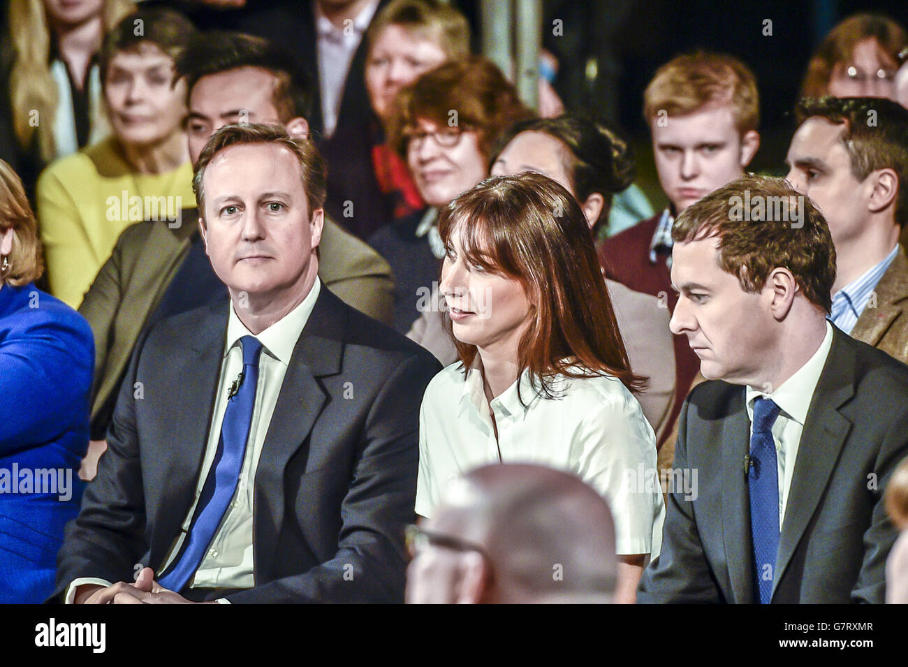 Prime Minister David Cameron and his wife Samantha Cameron sit next to ...