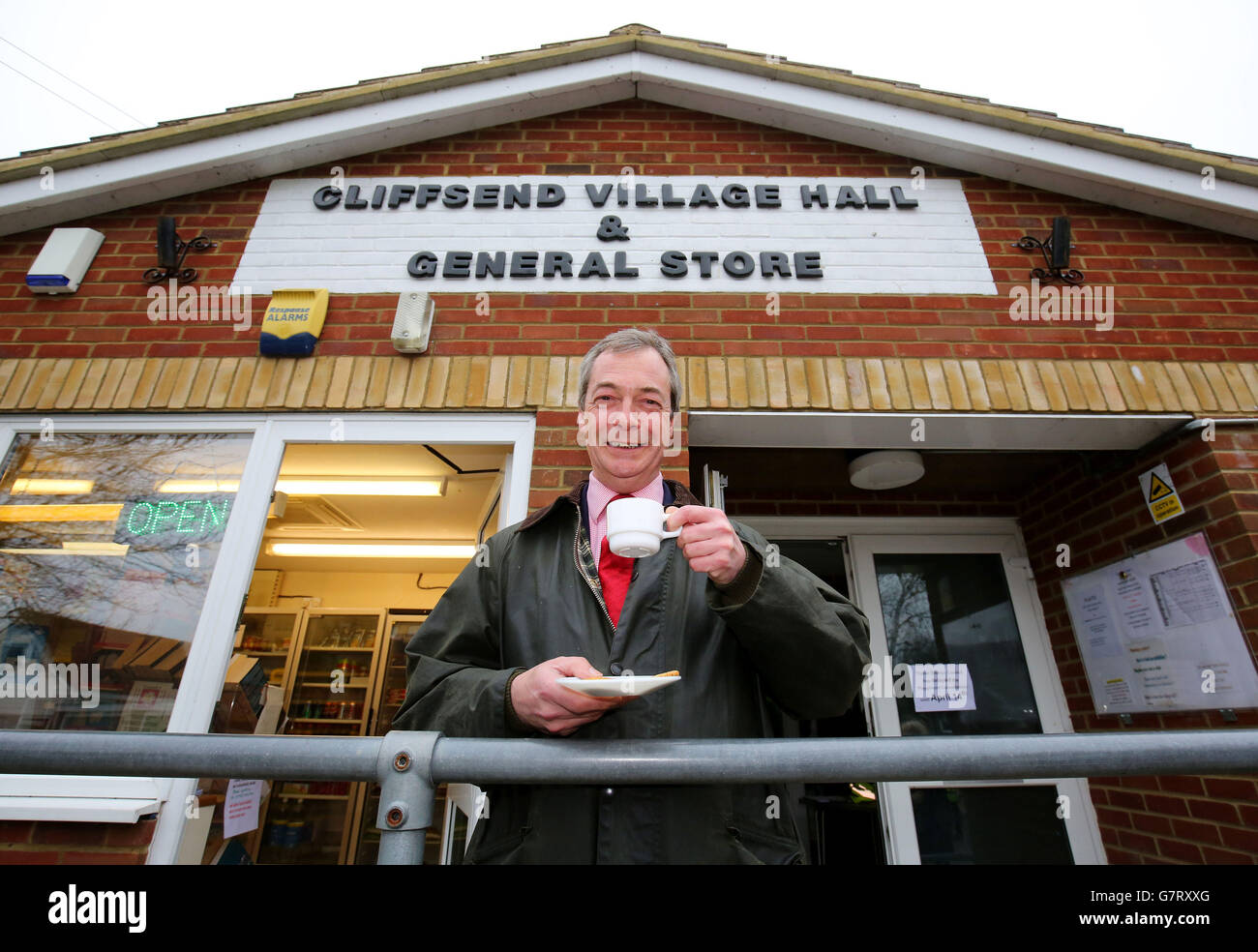 Ukip leader Nigel Farage enjoys a cup of tea outside Cliffsend Village ...