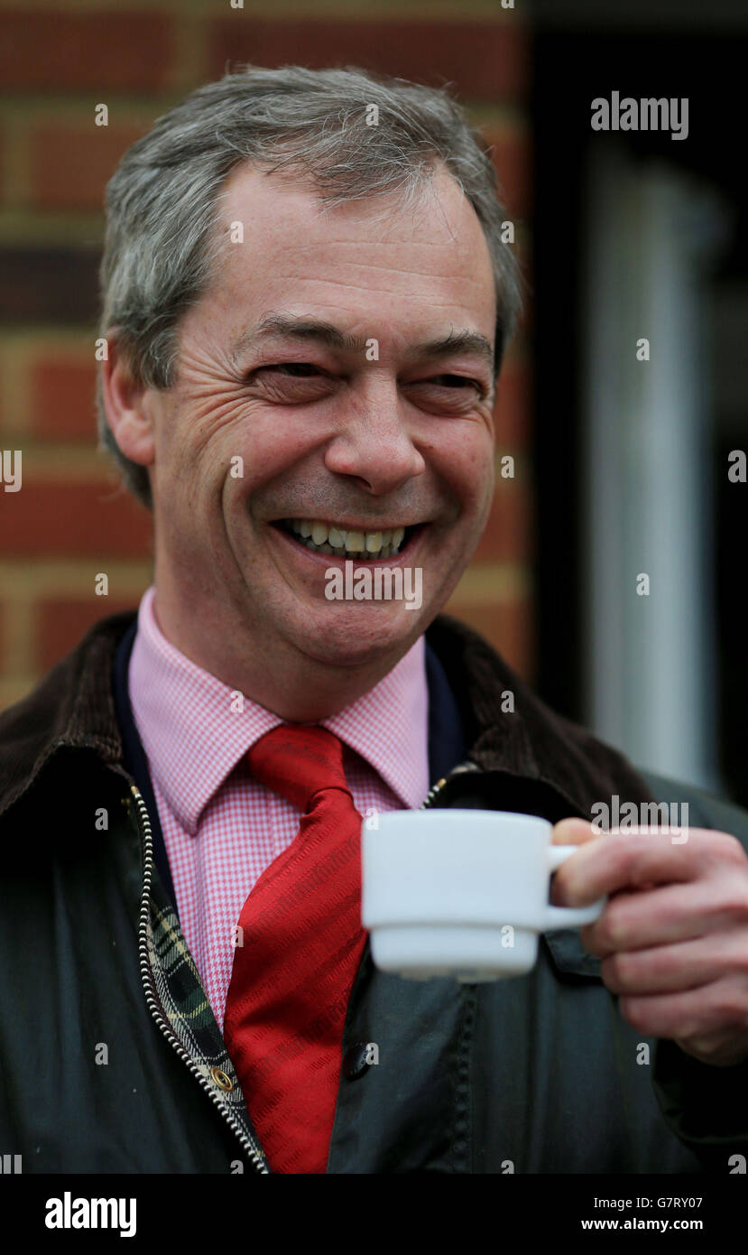 Ukip leader Nigel Farage enjoys a cup of tea outside Cliffsend Village ...