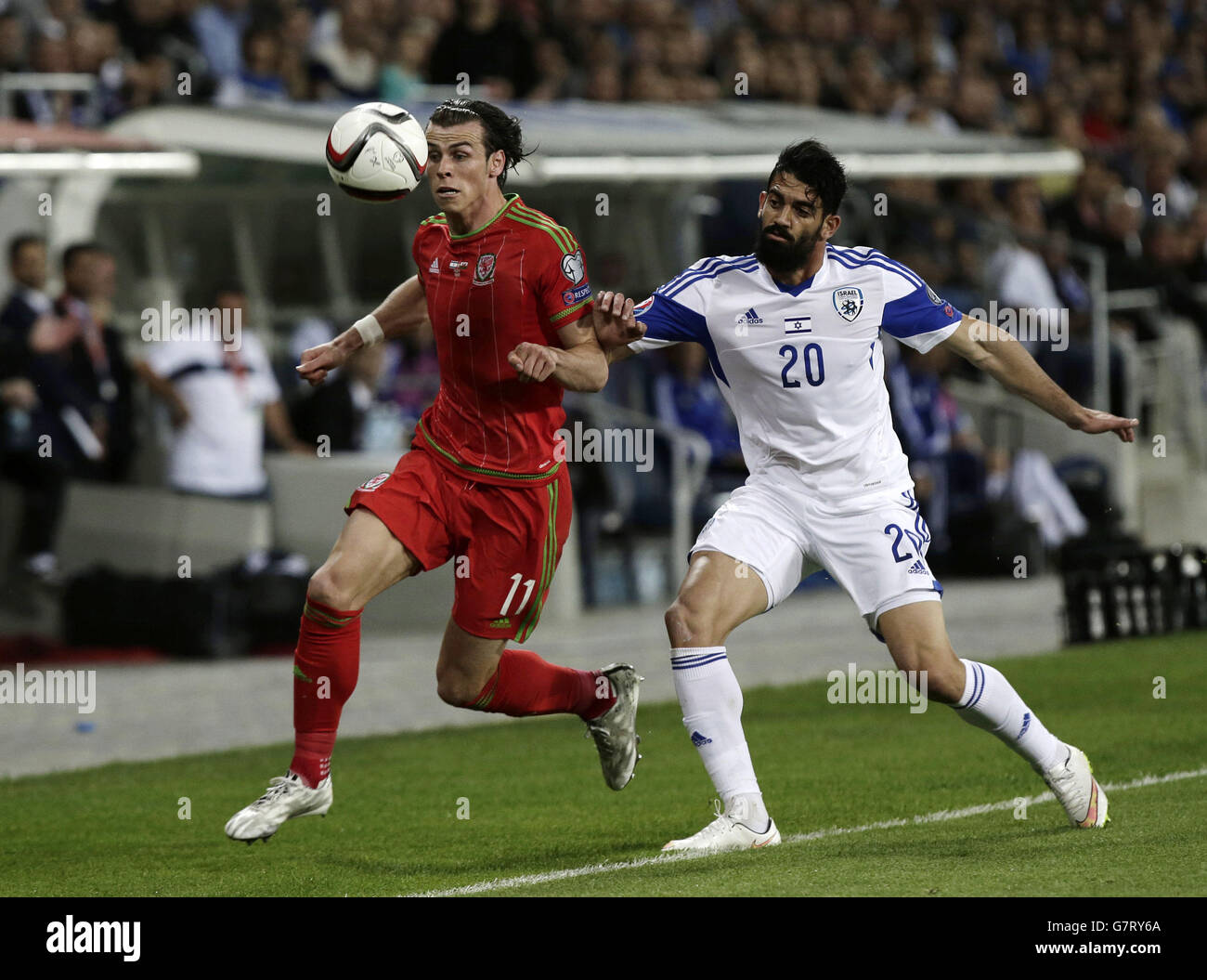 Wales' Gareth Bale (left) and Israel's Omri Ben Harush in action during ...