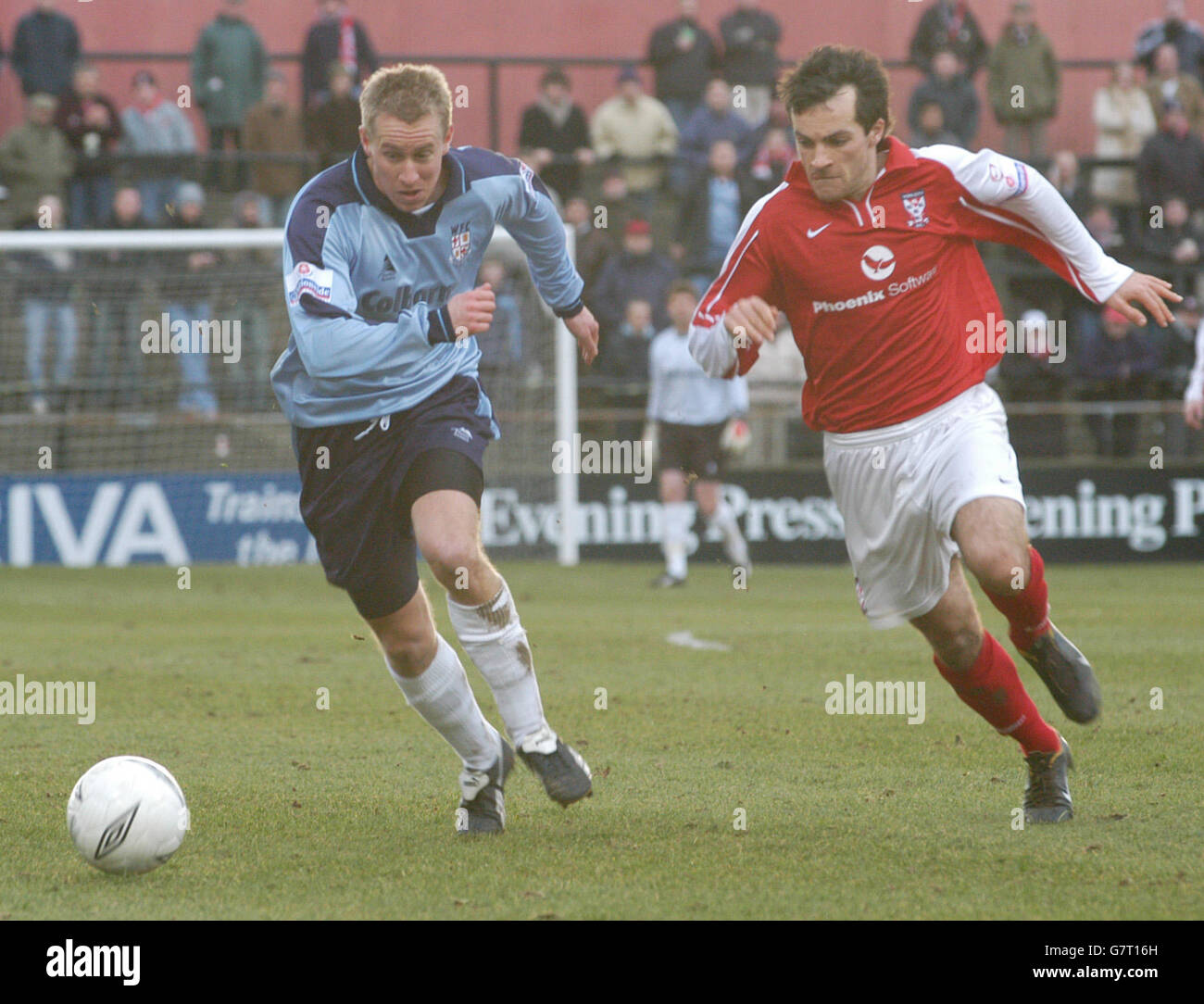 Woking's Chris Sharpling (left) and York's David Merris battle for the ...