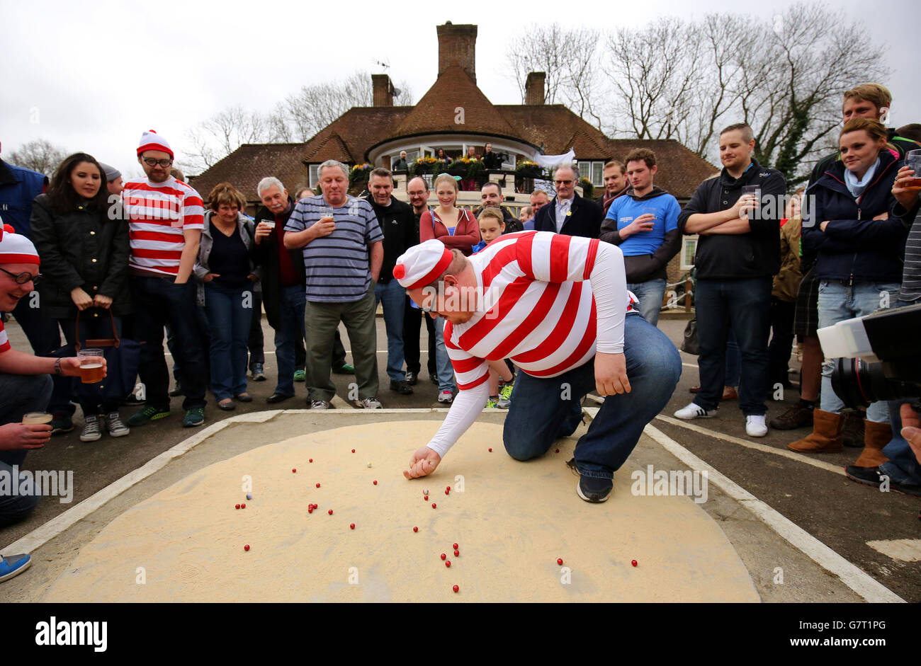 A member of the Where's Tolley marbles team takes a shot in a game ...