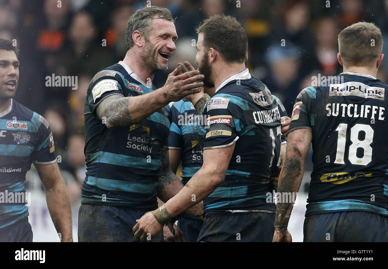 Leeds Rhino's Adam Cuthbertson celebrates a try with Jamie Peacock ...