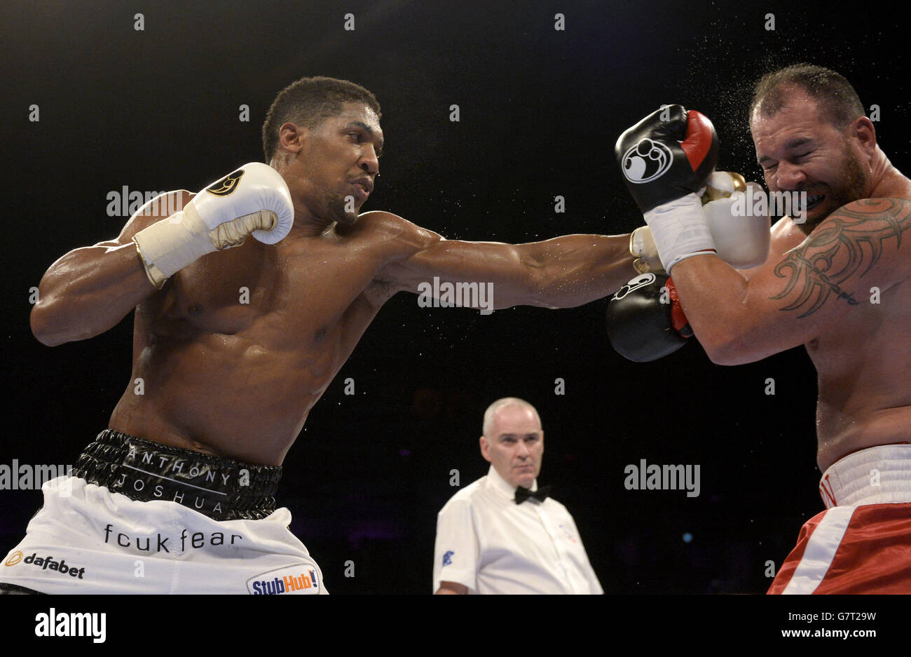 Anthony Joshua (leftt) in action against Jason Gavern during their WBC ...